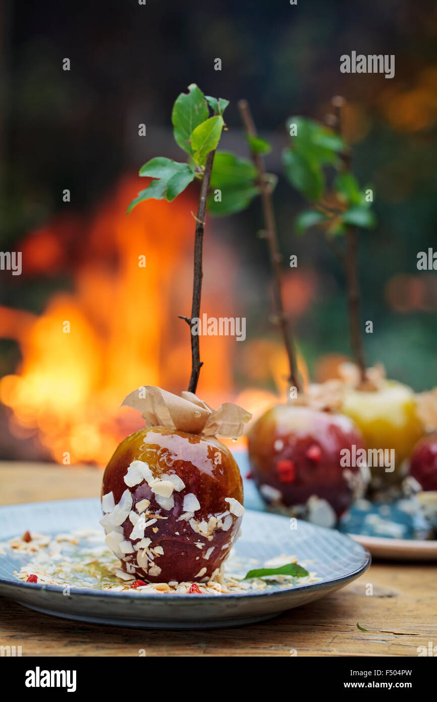 Toffee apples and a bonfire in the background Stock Photo - Alamy
