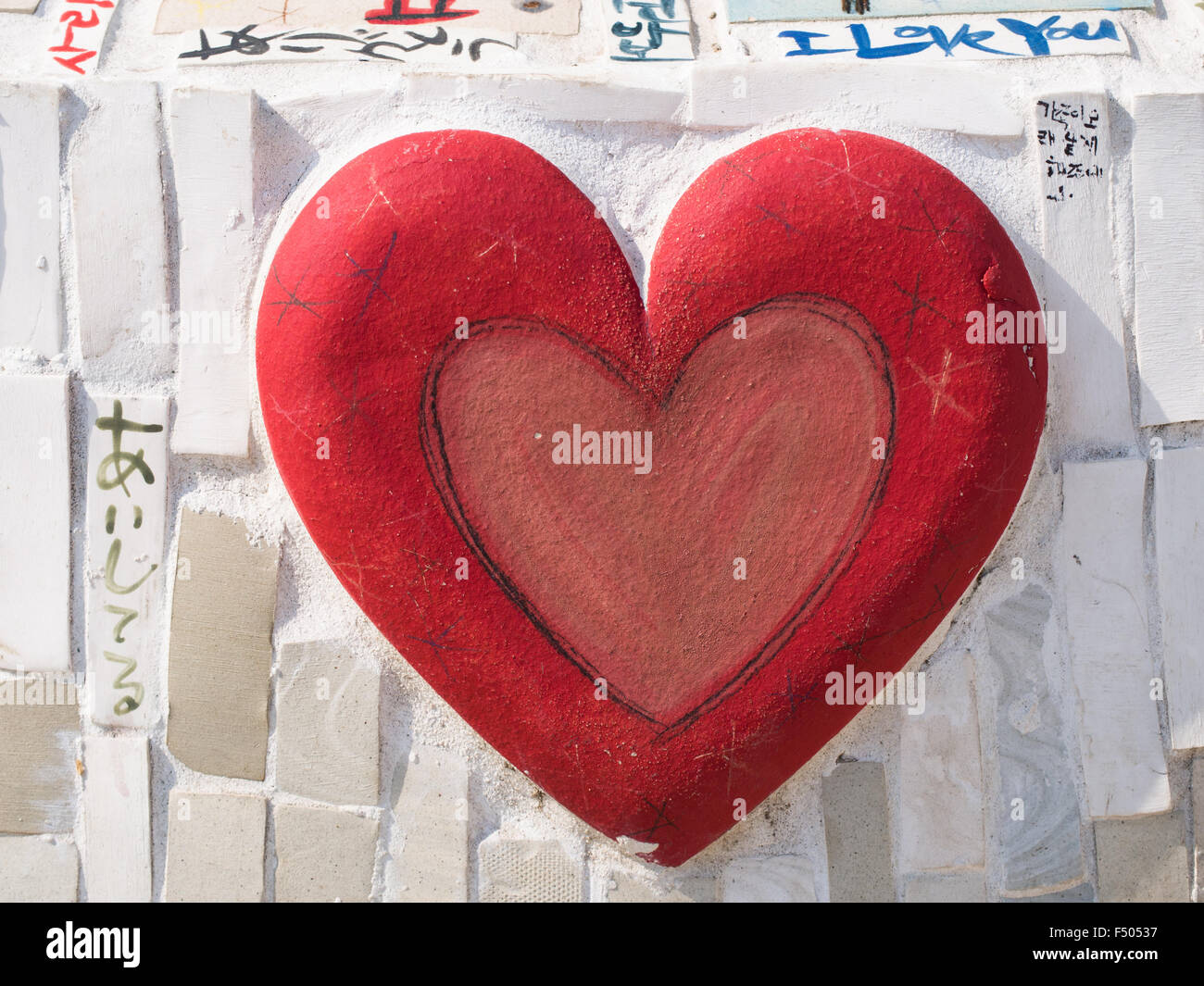A red stone heart Stock Photo - Alamy