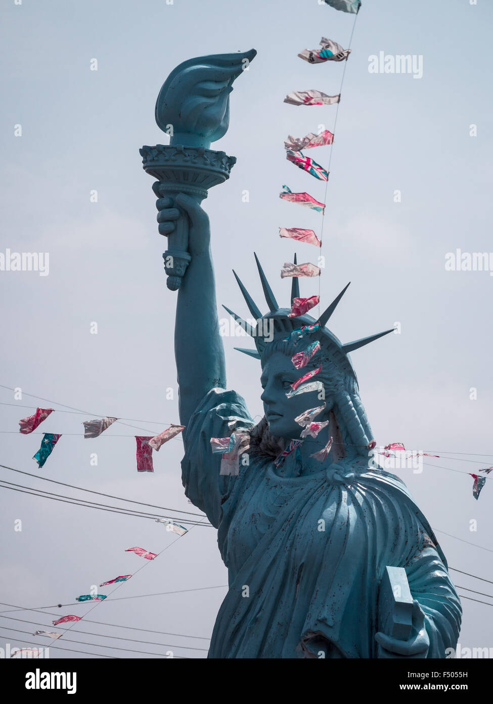 Choking Lady Liberty: Ropes wrapped around the neck of a replica of the ...
