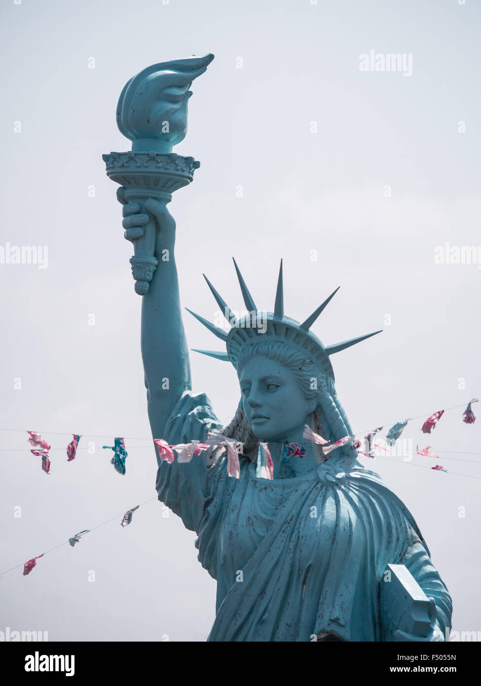 Choking Lady Liberty: Ropes wrapped around the neck of a replica of the ...