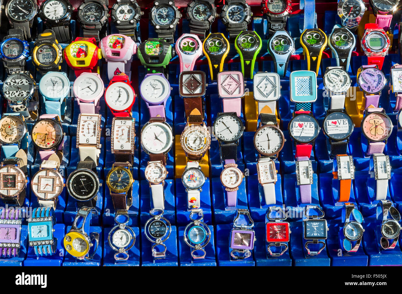 Many different colorful wristwatches on display in a shop Stock Photo ...