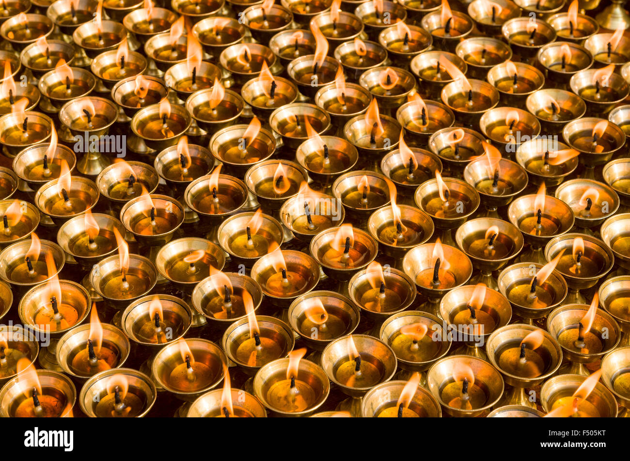 Butterlamps, lighted, as offerings at Boudnath Stupa Stock Photo - Alamy