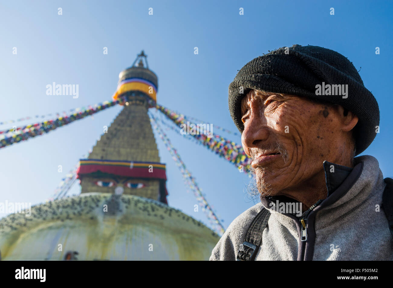 Portrait of a pilgrim with Boudnath Stupa in the background Stock Photo ...