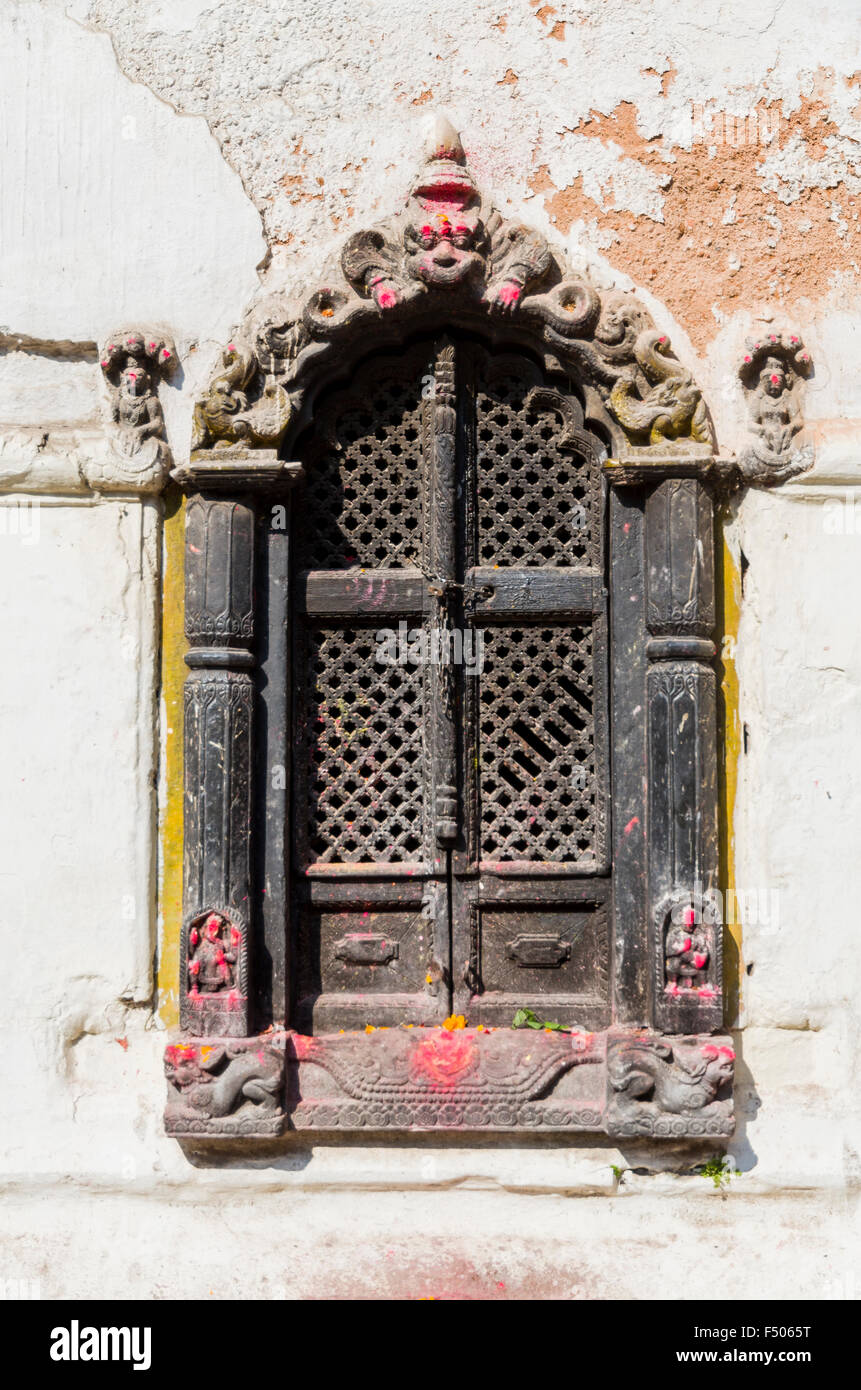 Beautifully carved wooden window of a small shrine in the hills above ...