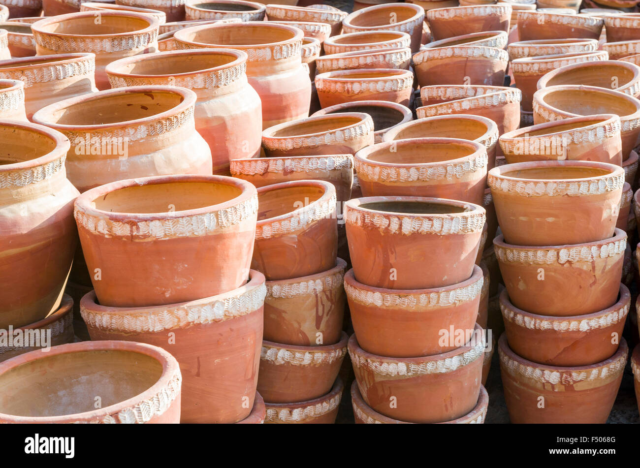 Newly made pottery is drying in the sun Stock Photo - Alamy