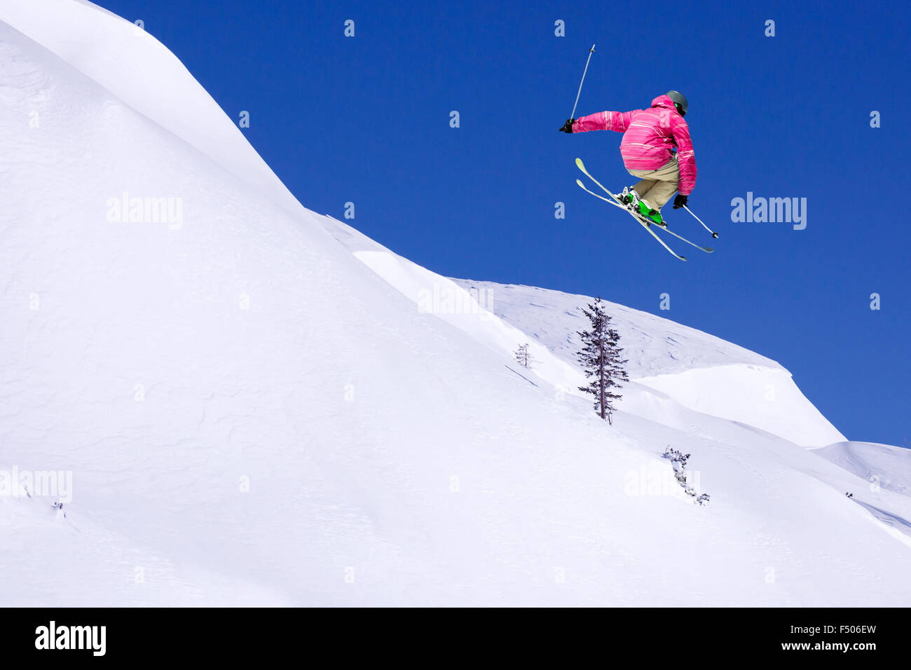 Extreme Skier in the jump in high mountains Stock Photo - Alamy