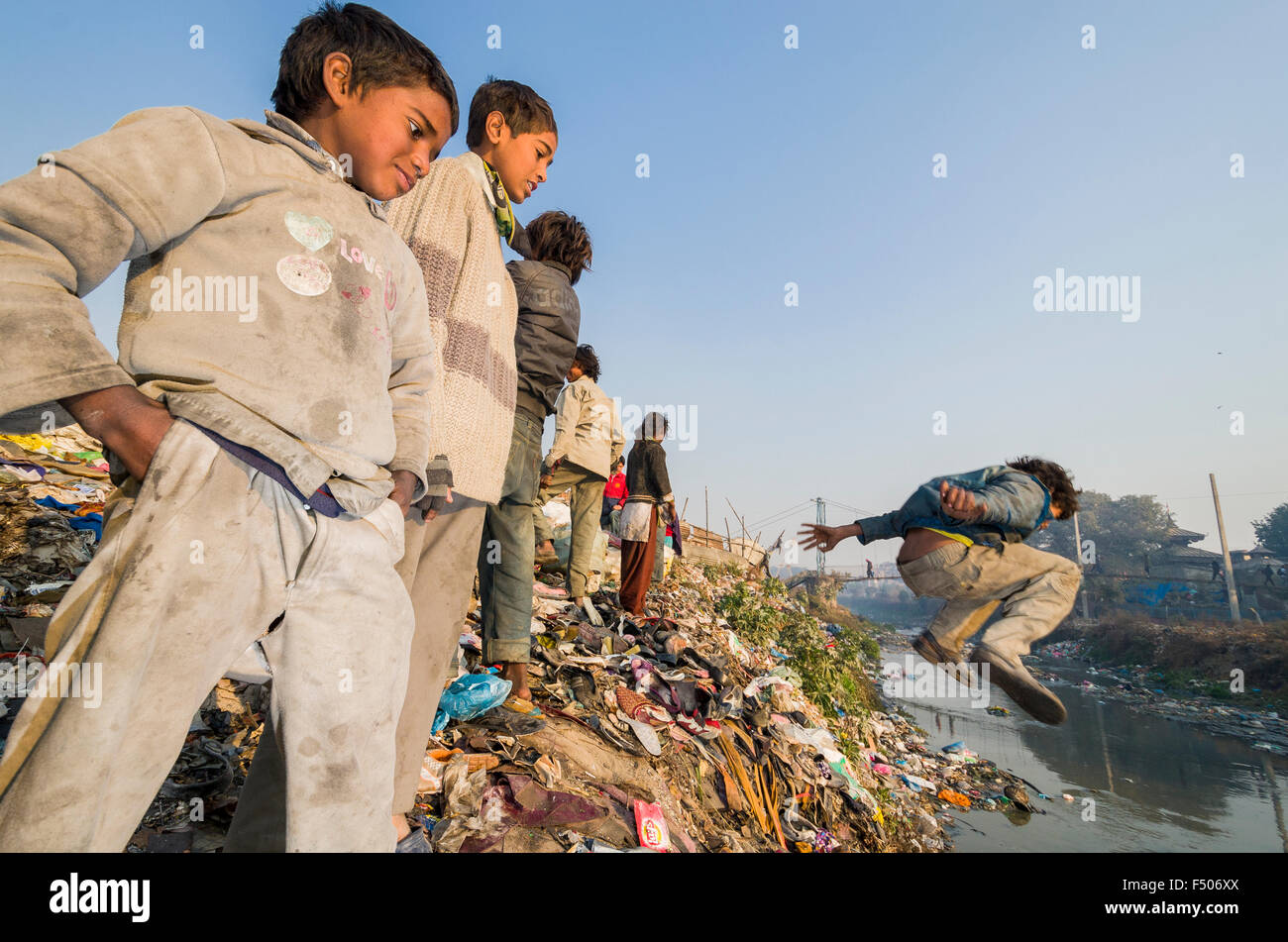 Children live, play and work on the garbage dump at Bhagmati River in ...