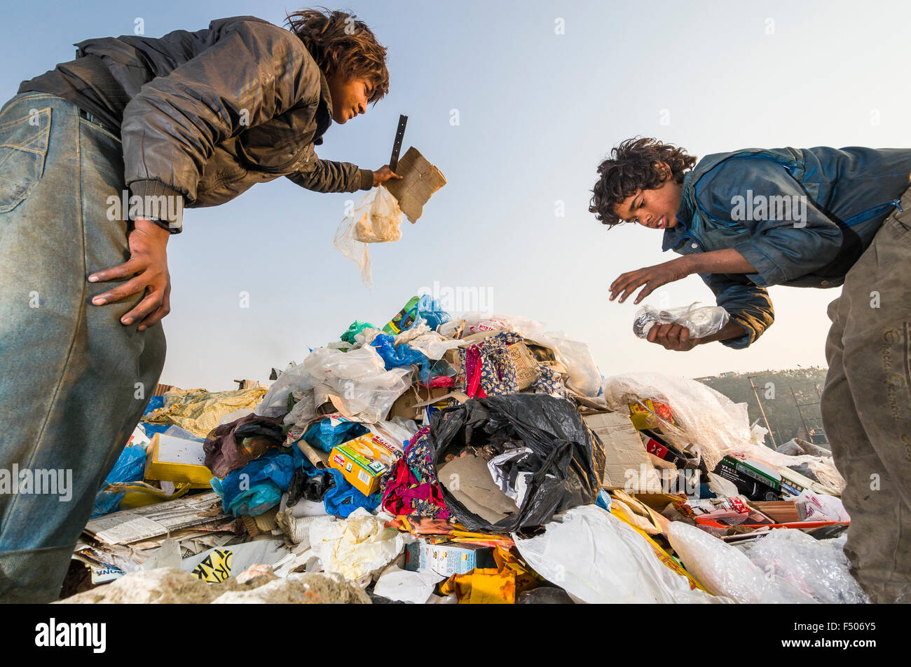 Children live, play and work on the garbage dump at Bhagmati River in ...