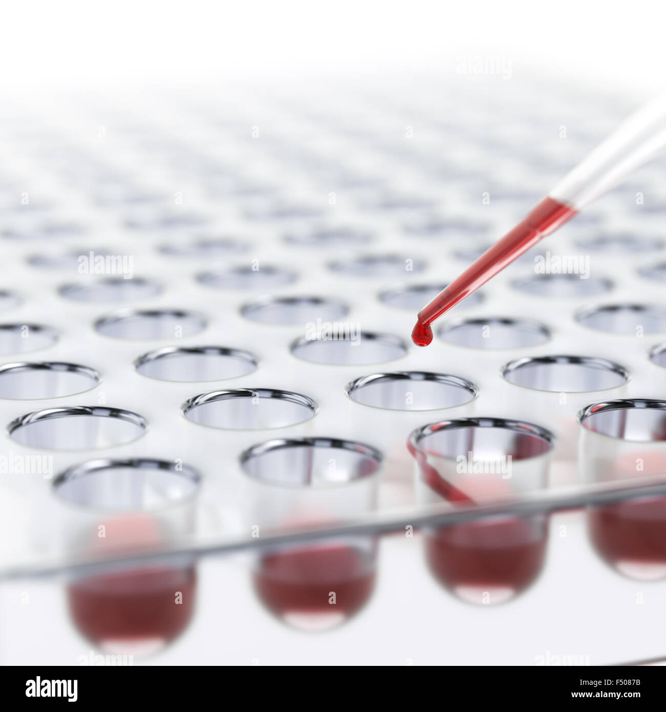 Dropping blood sample in test-tube close-up Stock Photo - Alamy