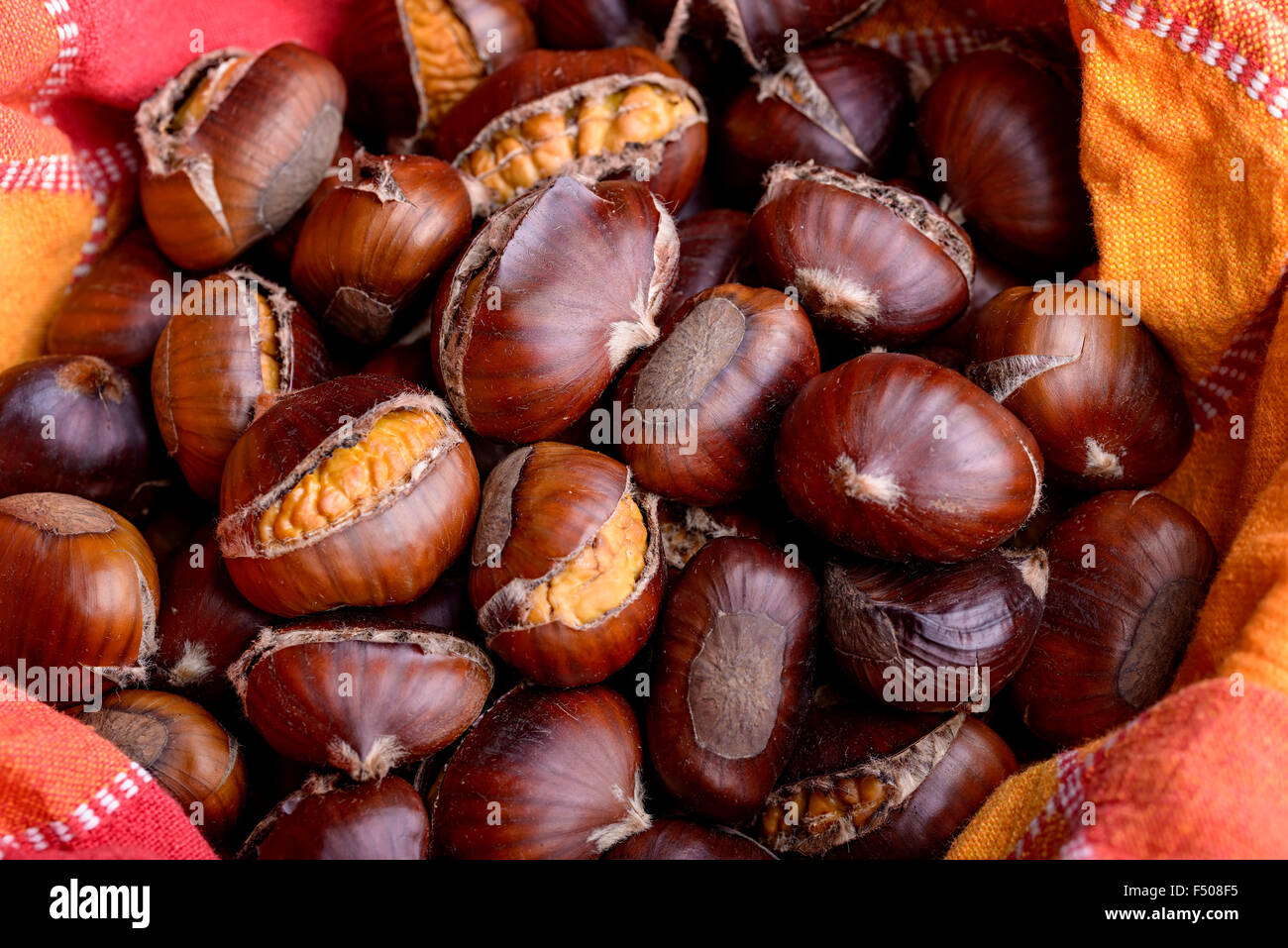 roasted chestnut inside a bowl with cloth napkin Stock Photo - Alamy