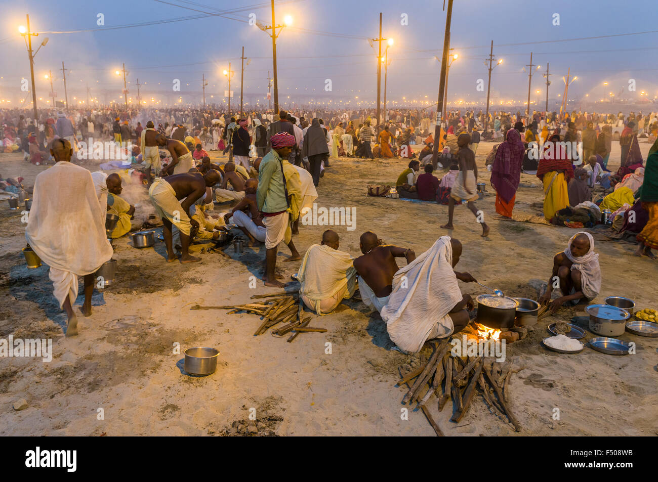 Millions of people gathering at Kumbha Mela ground, sitting and ...
