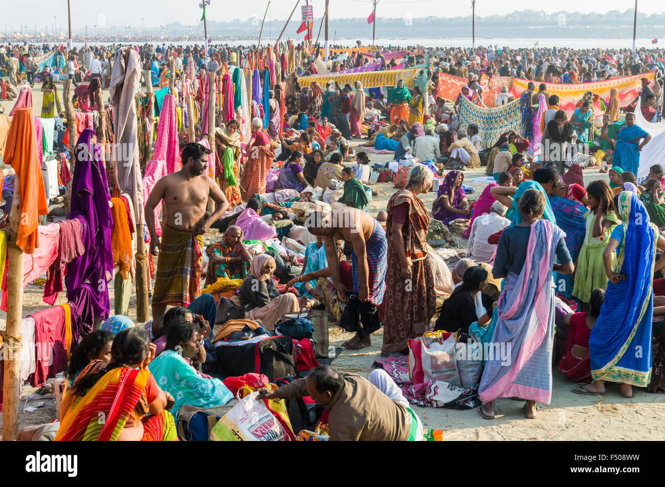 Millions of people gathering at Kumbha Mela ground, sitting and ...