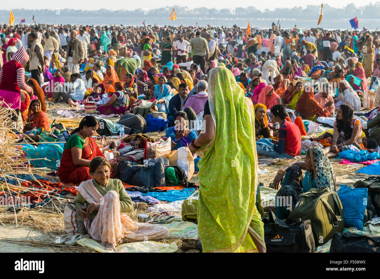Millions of people gathering at Kumbha Mela ground, sitting and ...