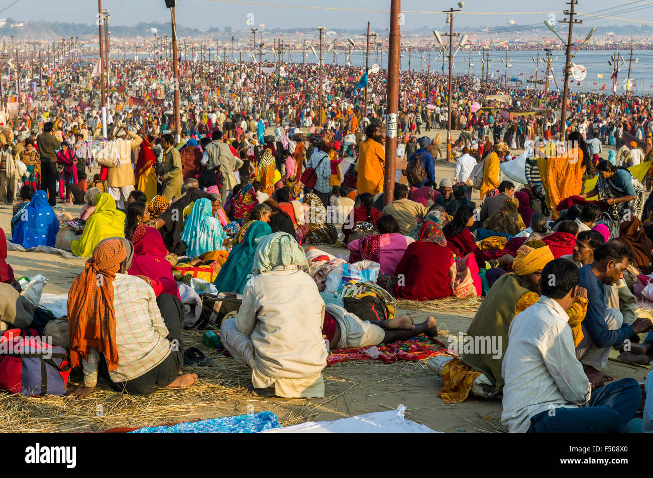 Millions of people gathering at Kumbha Mela ground, sitting and ...