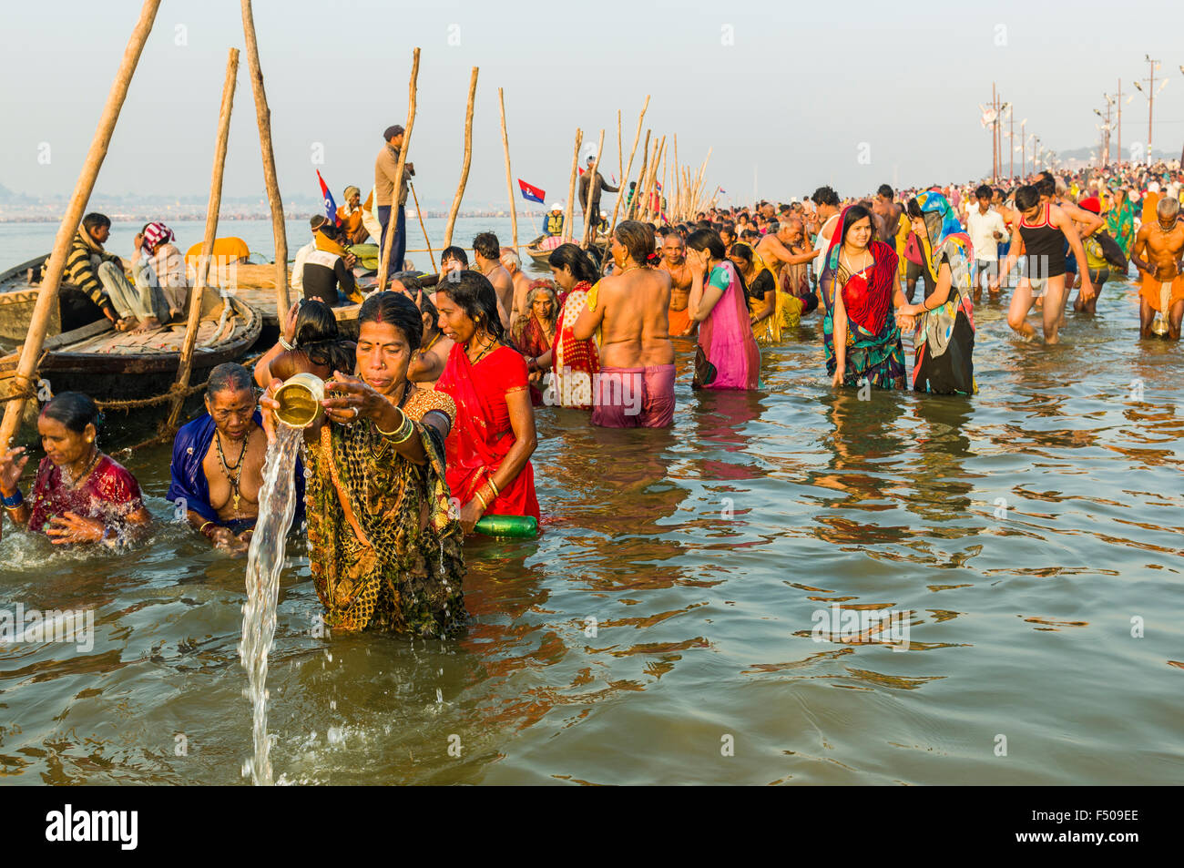 People taking bath at the Sangam, the confluence of the rivers Ganges ...
