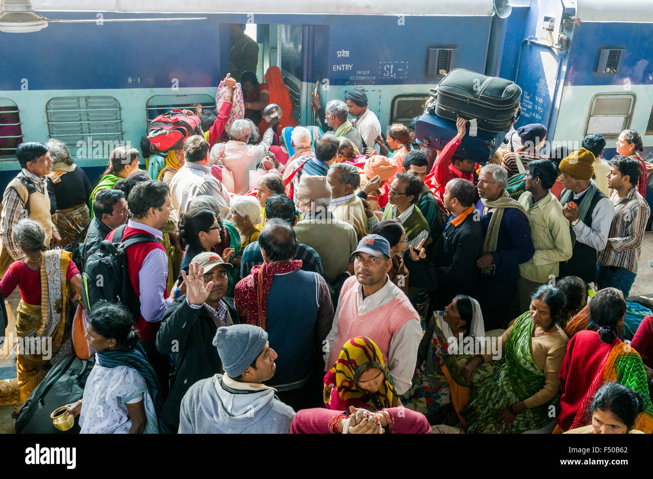 Many people waiting for delayed trains on a platform of the ...