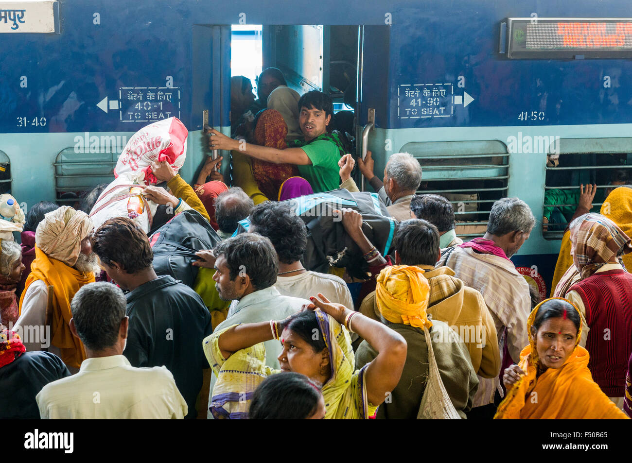 Many people waiting for delayed trains on a platform of the ...