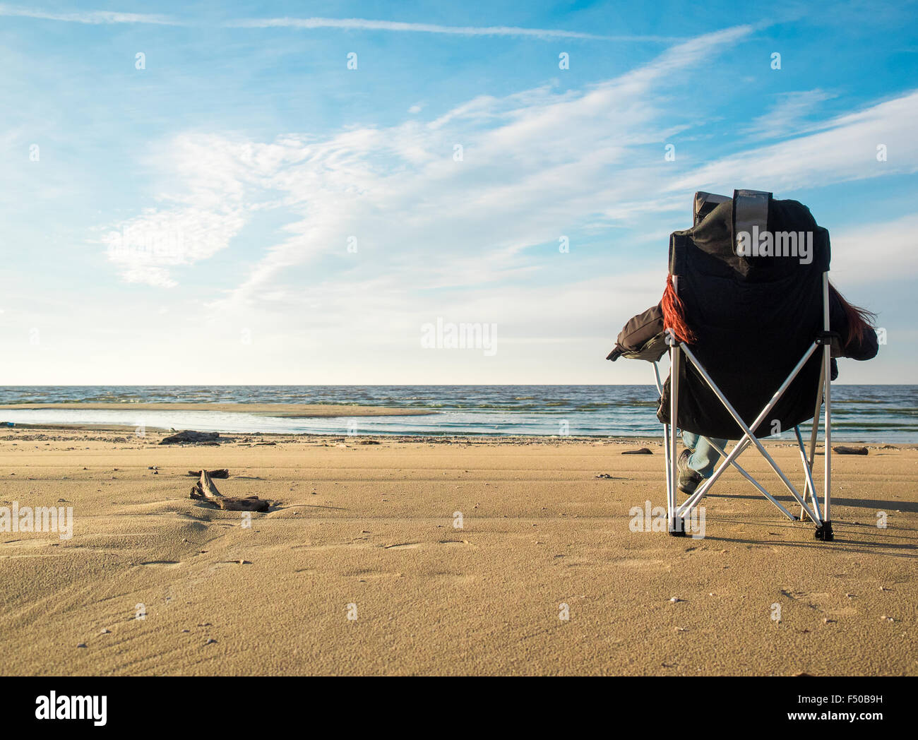 Woman resting on beach hi-res stock photography and images - Alamy