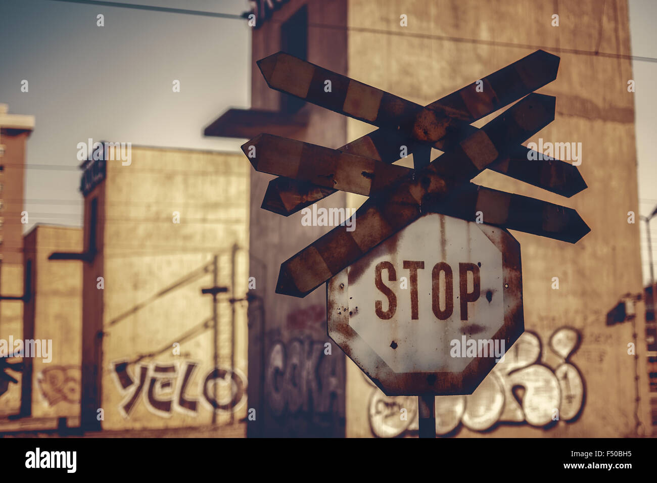 Old and rusty rail crossing stop sign. Dark apocalyptic scene Stock ...