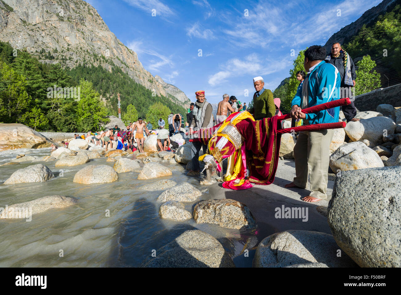 Pilgrims from all over India come to the banks of the river Ganges to ...