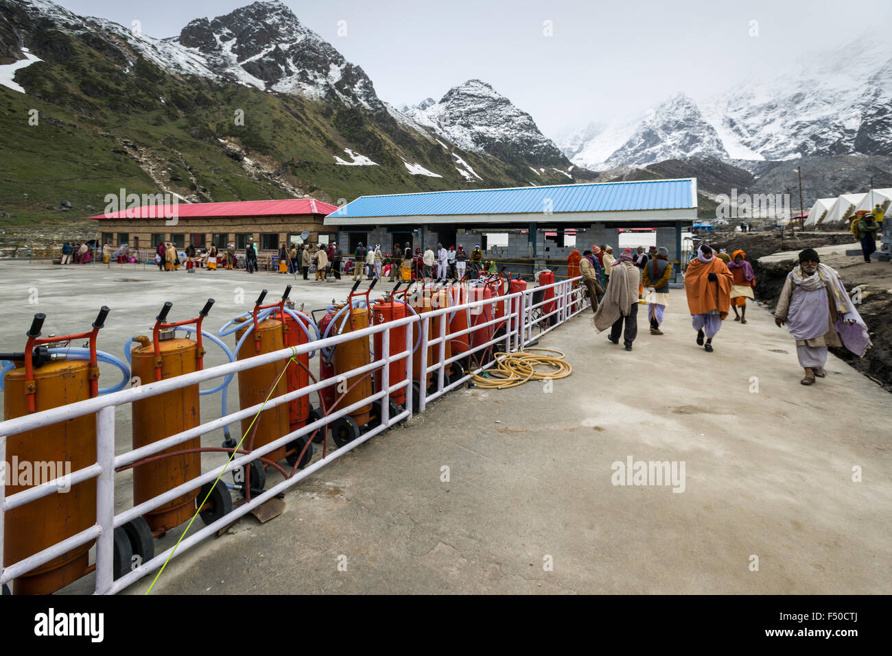 Fire extinguisher are placed at the helipad, snow capped mountains in ...