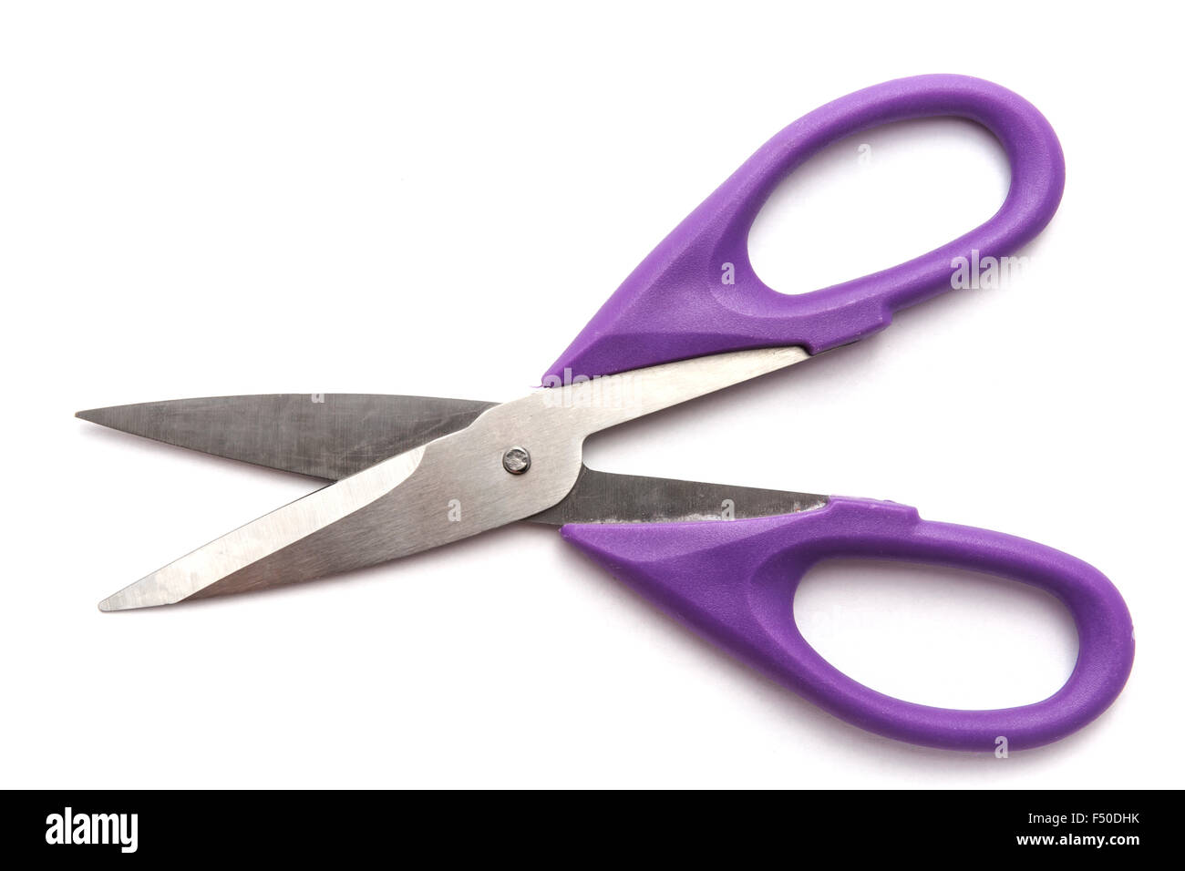 Purple scissors on white background Stock Photo - Alamy