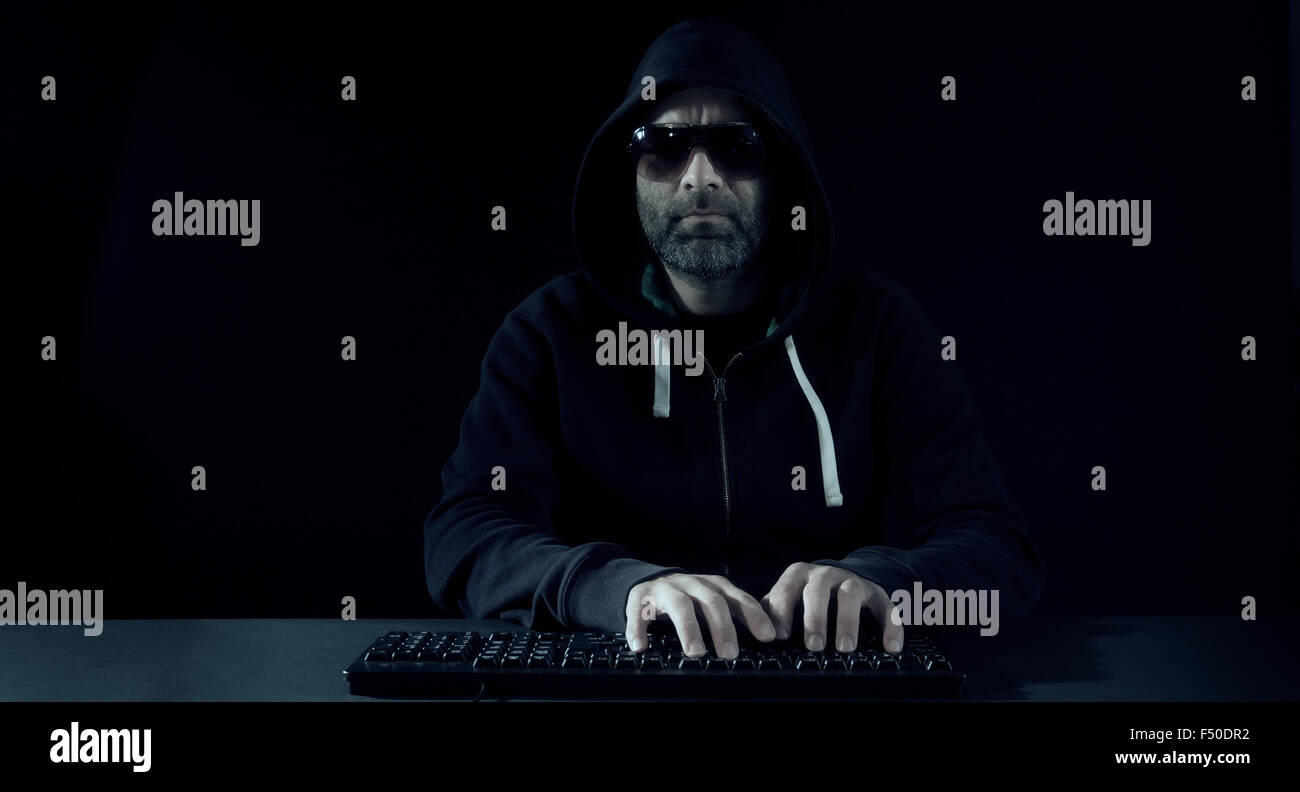 Computer programmer typing on keyboard, hacker hacking at night Stock ...