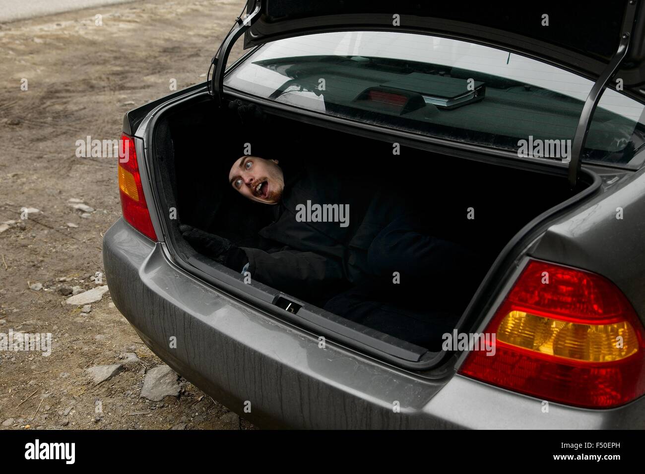 Man in the trunk Stock Photo - Alamy