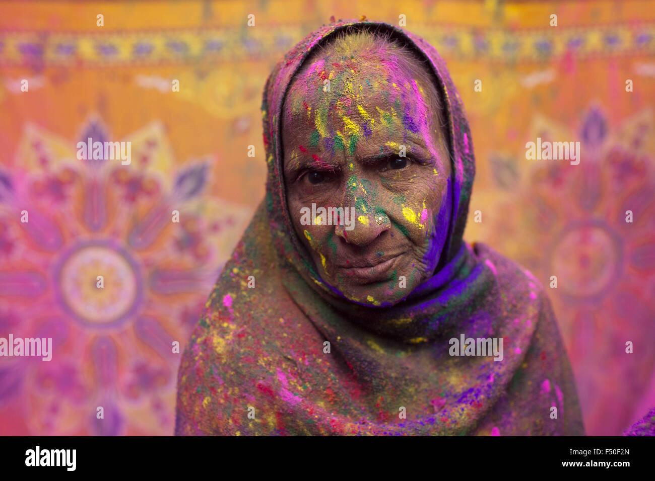 Vrinddavan, India. 3rd Mar, 2015. Indian widow covered with colored ...