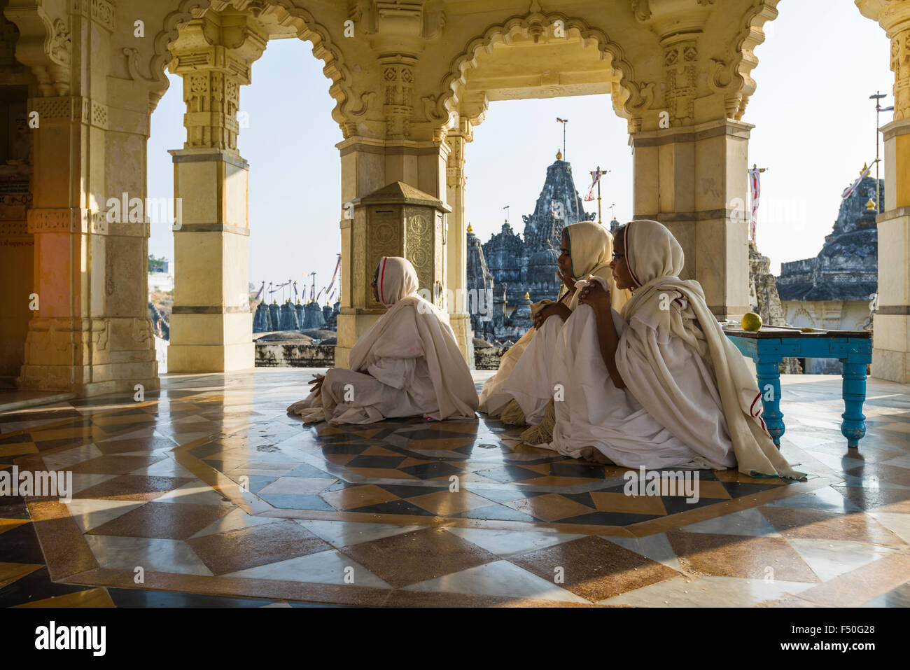 A group of Jain nuns is visiting a temple at Shatrunjaya hill, one of ...