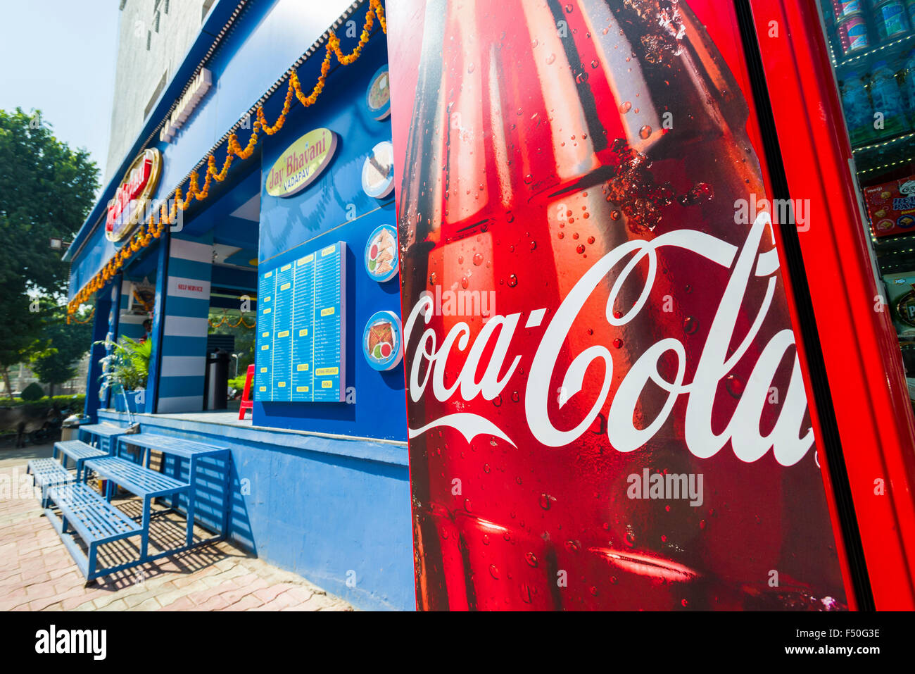 A big advertisement for Coca Cola at the entrance of a new, western ...