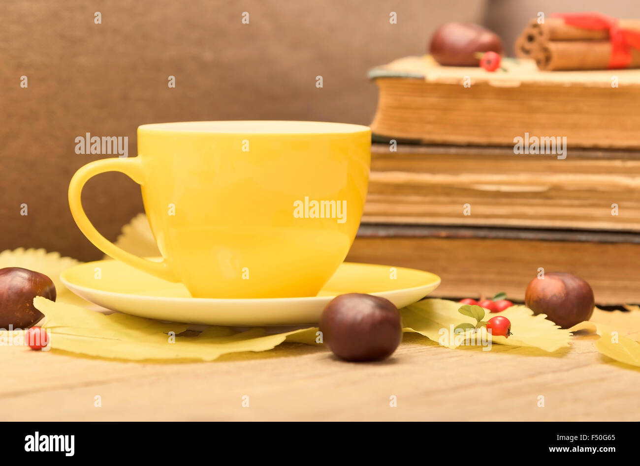 Autumn still-life with a cup of tea and old books Stock Photo - Alamy