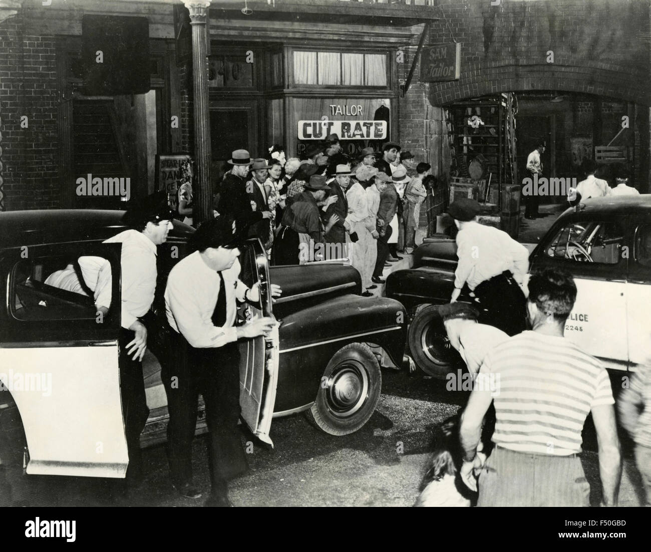 Movie scene with unidentified police raid hi-res stock photography and ...