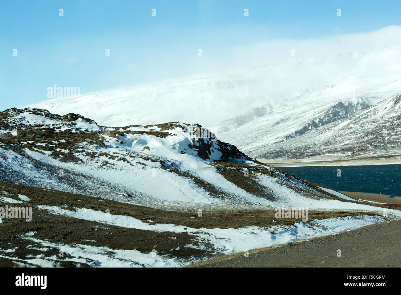 Snow-covered volcanic mountain landscape in Iceland Stock Photo - Alamy