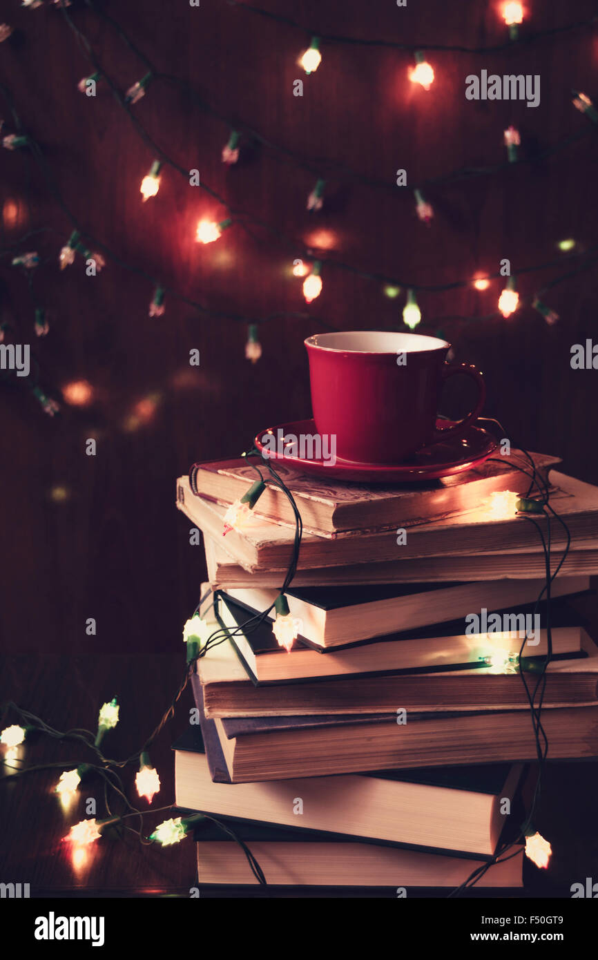 Books, tea and Christmas lights Stock Photo - Alamy