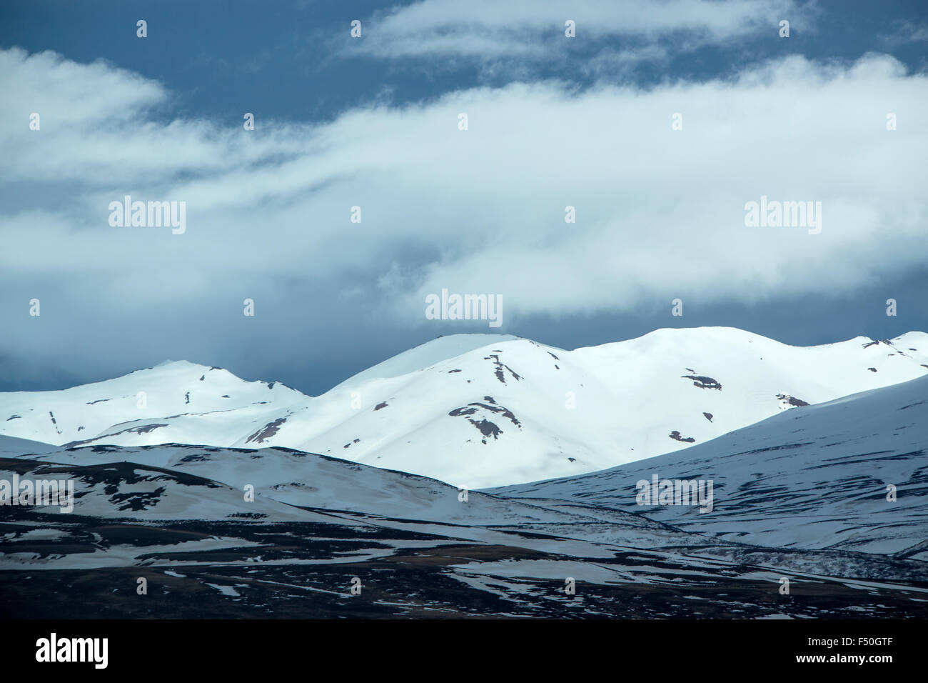 Snow-covered volcanic mountain landscape in Iceland Stock Photo - Alamy