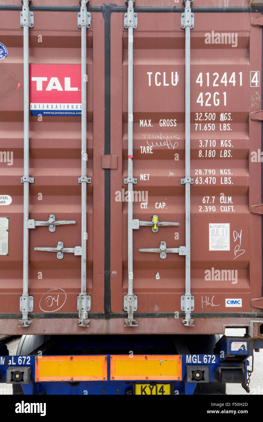 Shipping container locking handles with a uniquely numbered customs ...