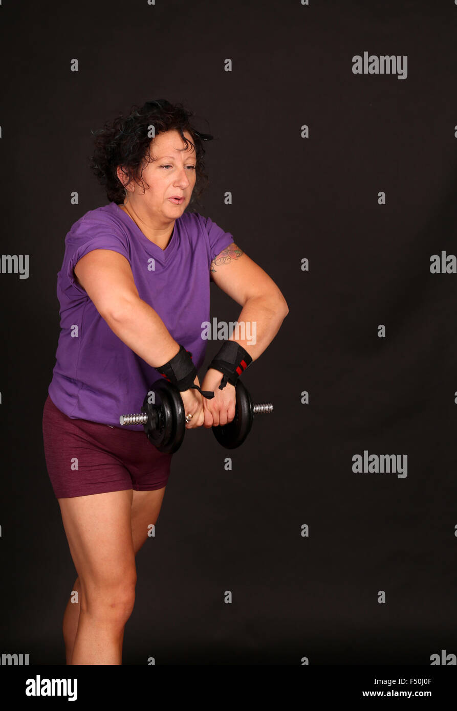 Mature female boxer exercising with weights, September 2015 Stock Photo ...