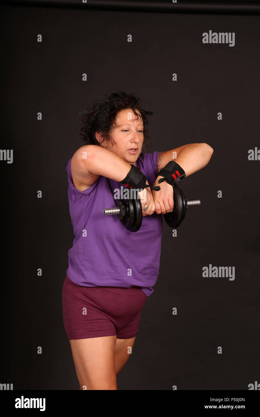 Mature female boxer exercising with weights, September 2015 Stock Photo ...