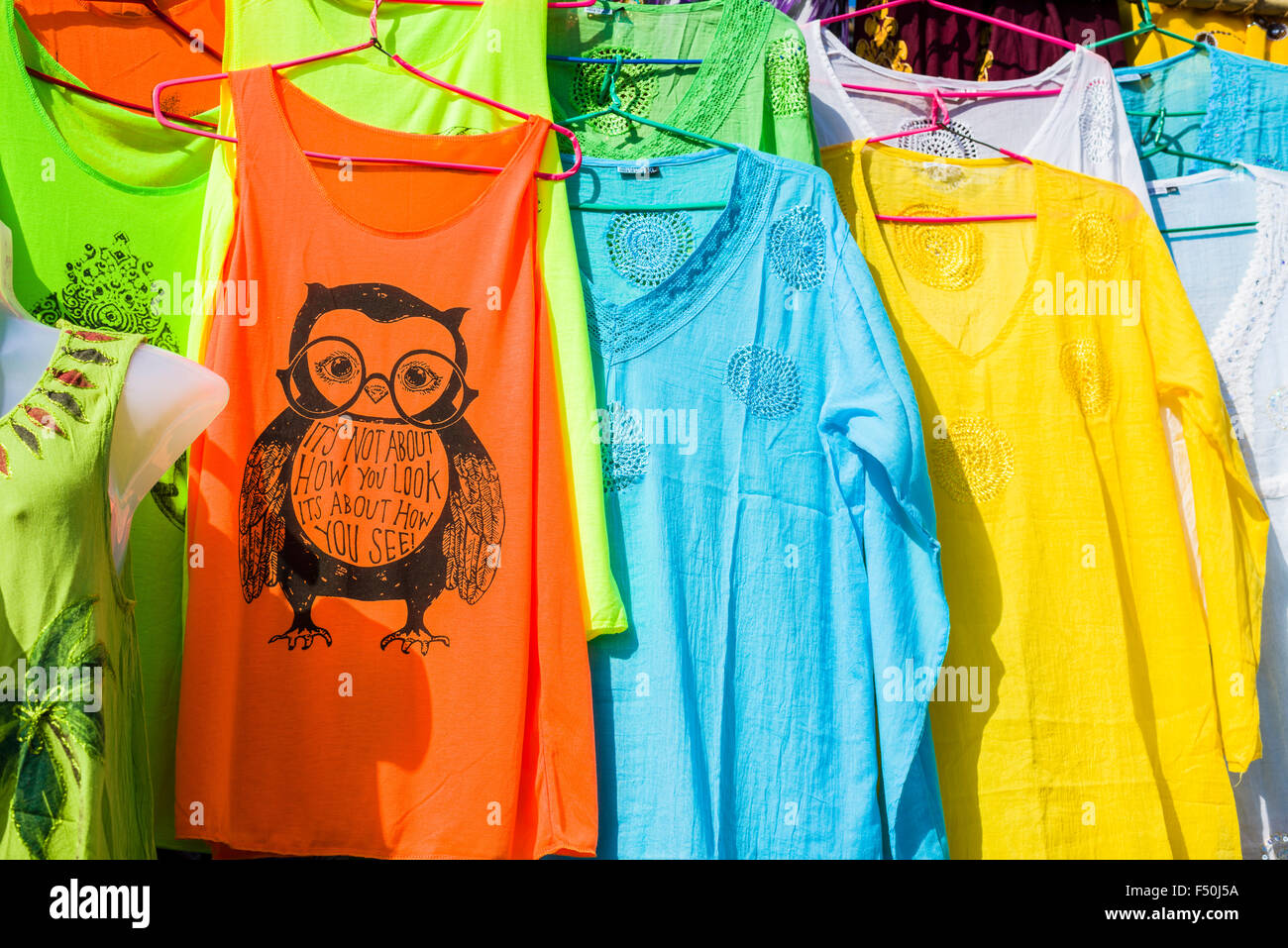 Many different goods like artfully designed colorful cloths are ...