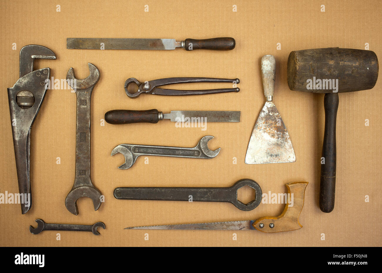 View of old set tools. Hammer, putty, knife, pliers, saw, file, wrench ...