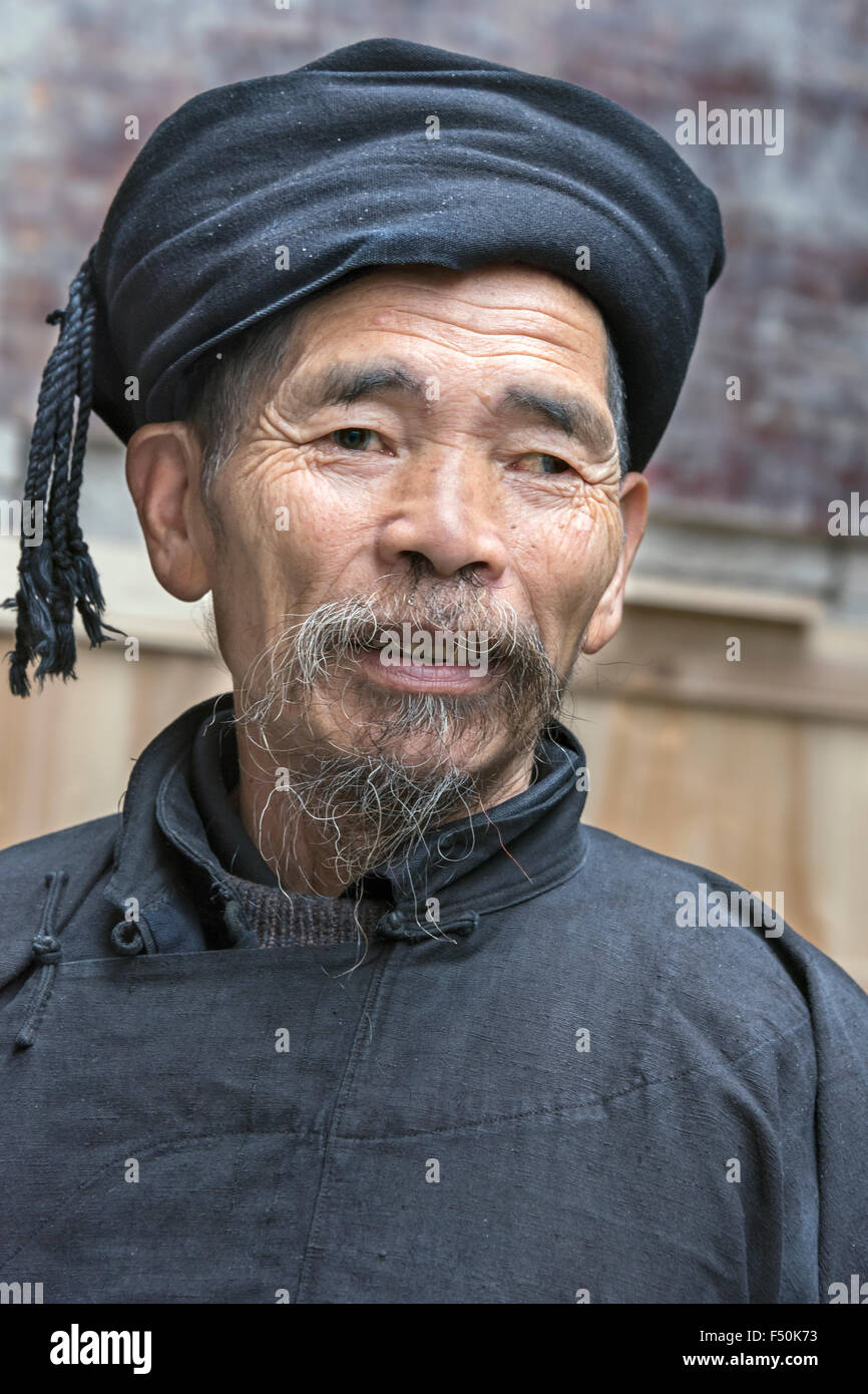 Elderly Miao man in traditional attire, Langde Shang Miao Village ...