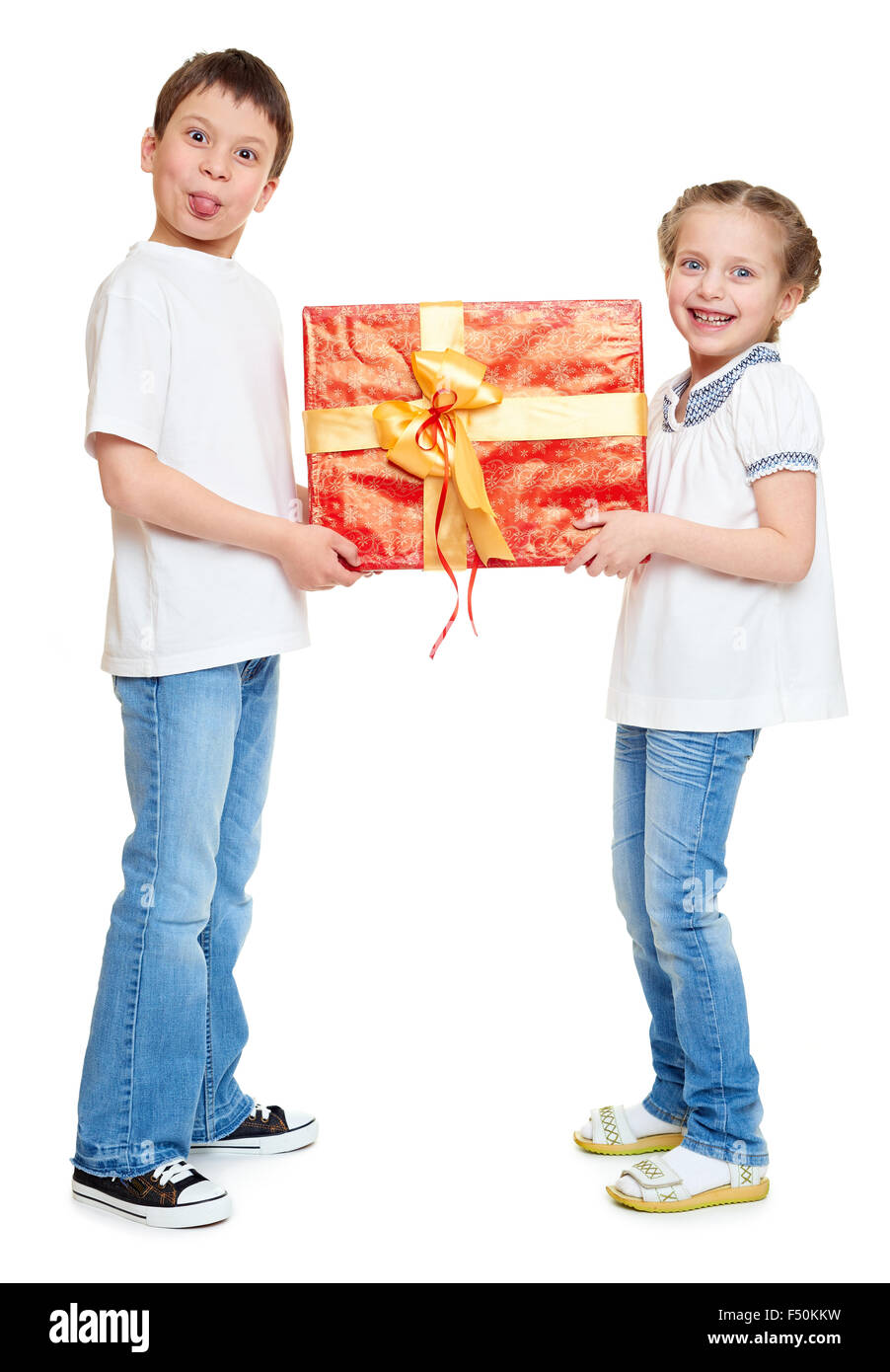 boy and girl with red gift box and golden bow - holiday object concept ...