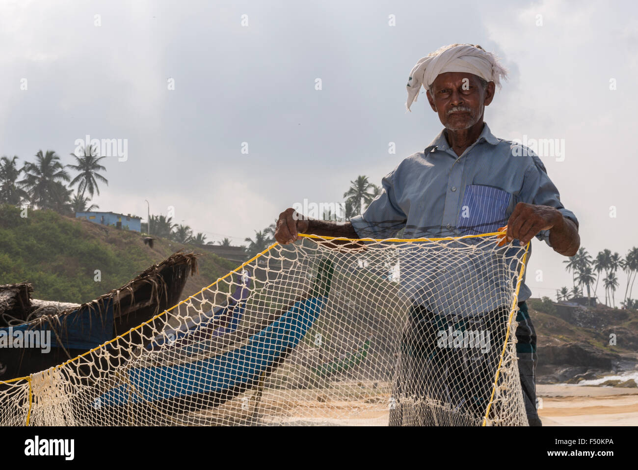 Man repairing a fishing net hi-res stock photography and images - Alamy