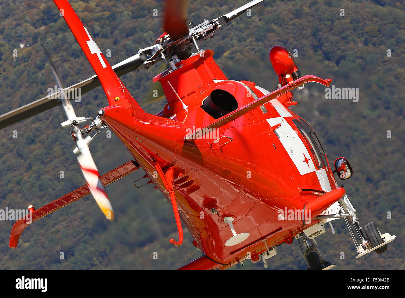 Mountain rescue helicopter taking off Stock Photo - Alamy