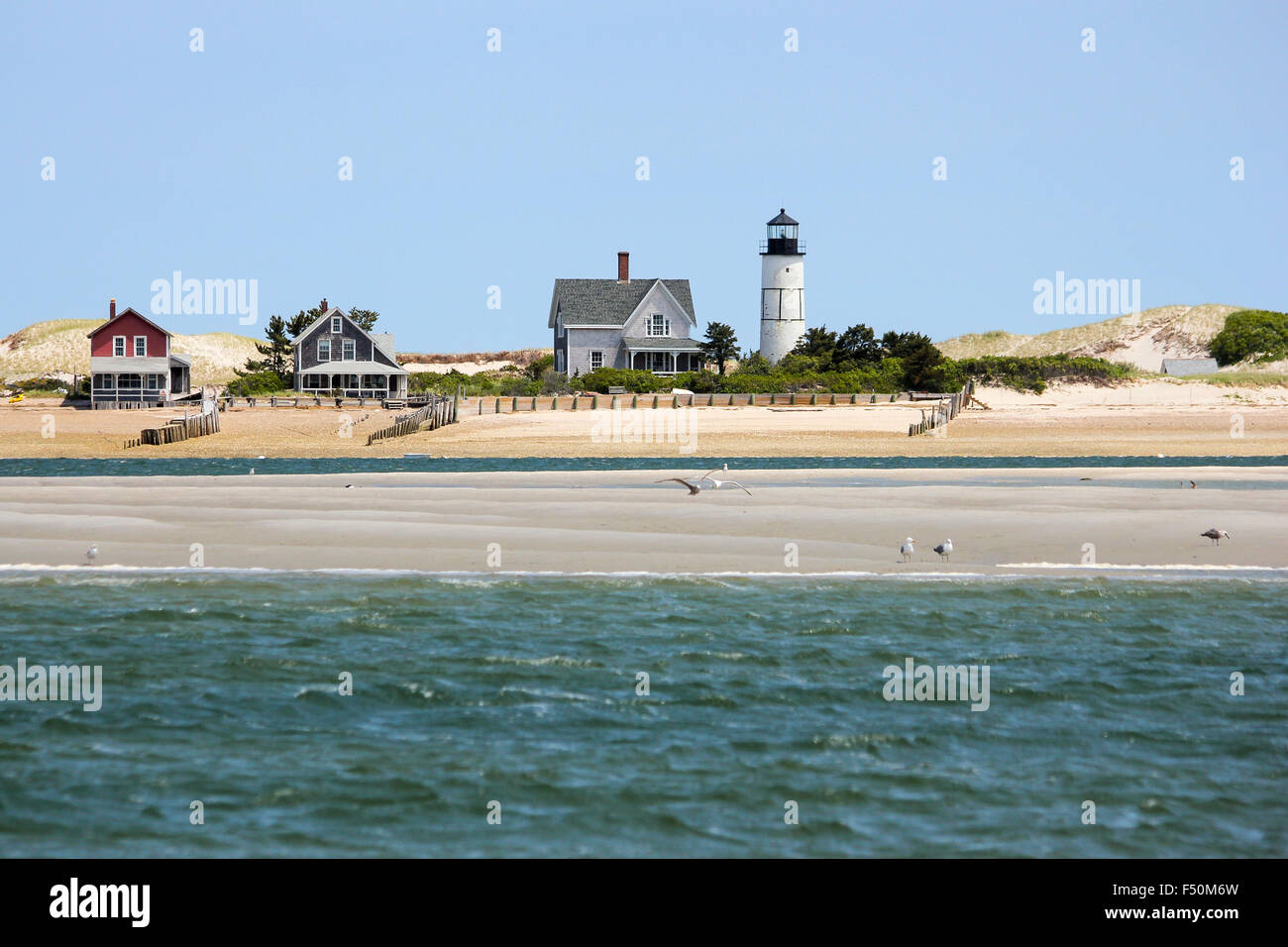 Sandy Neck Beach's old cottage colony and Sandy Neck Lighthouse seen ...