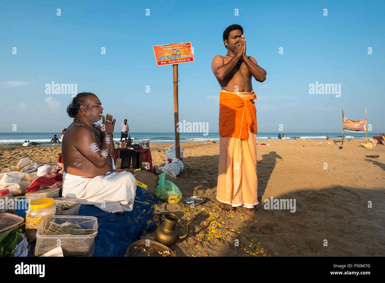 One priest is offering the Veli Tarpanam Pooja, a farewell ritual for ...