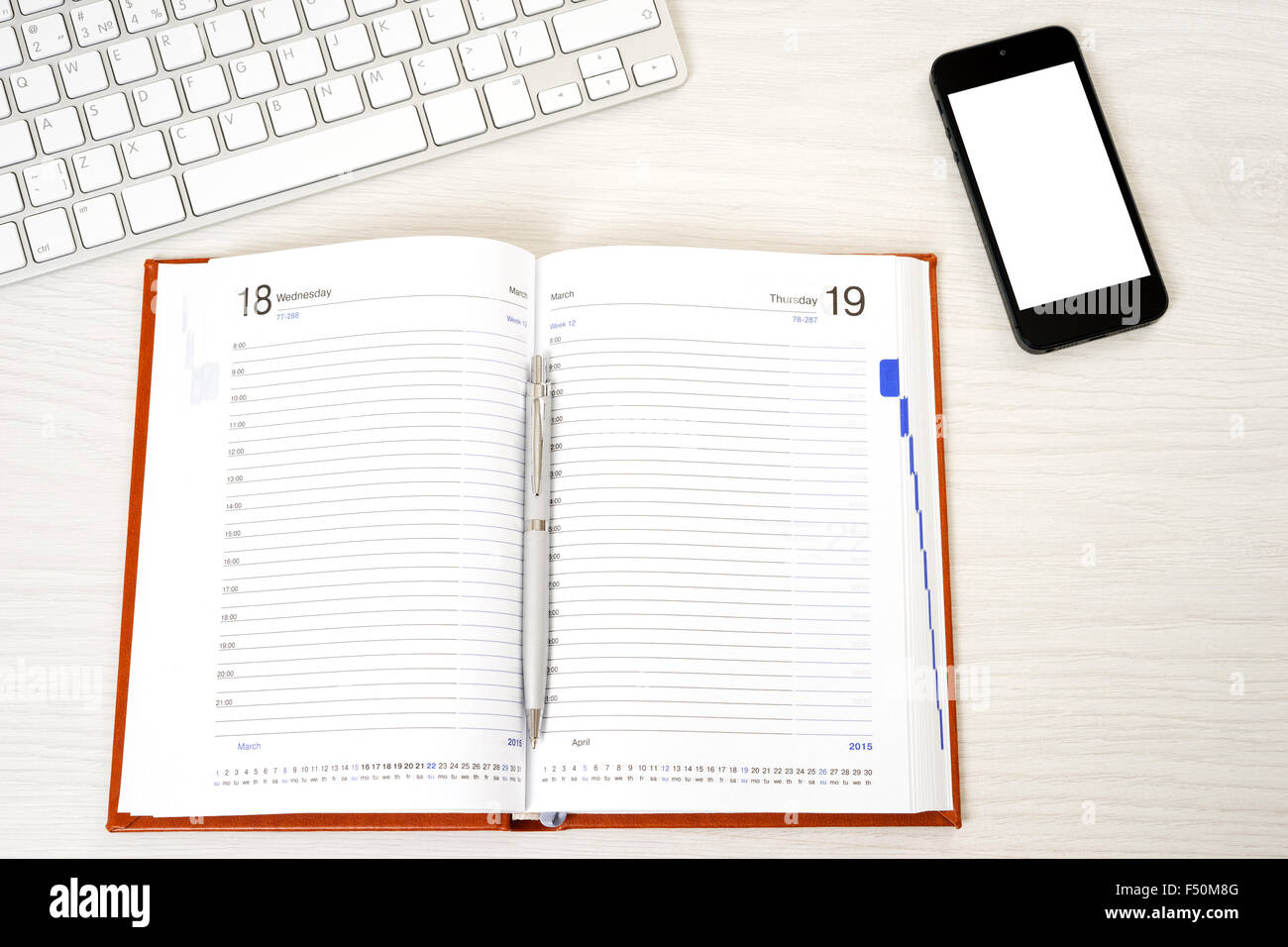 Workplace with phone and notepad, and coffee Stock Photo - Alamy