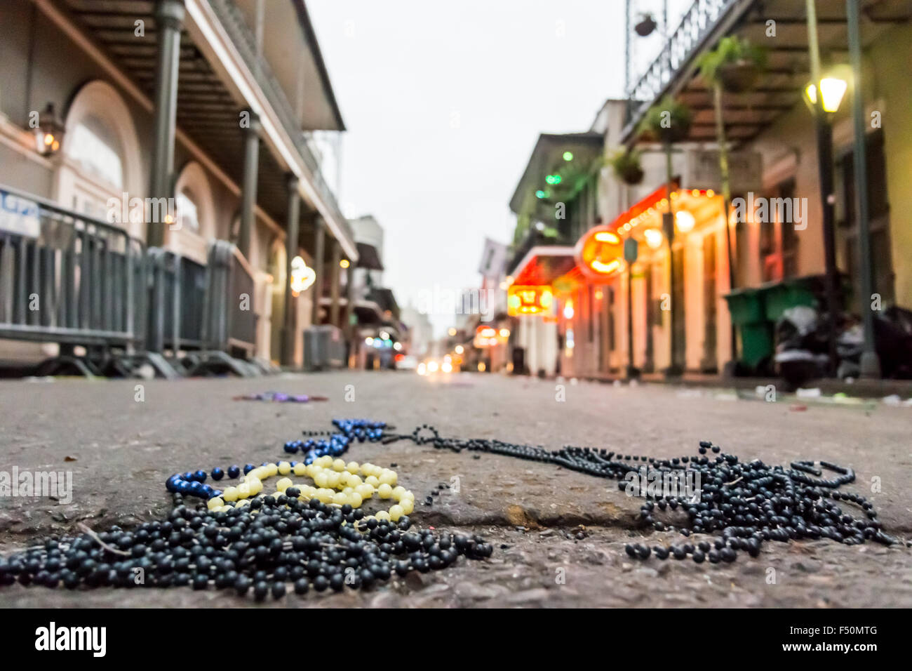 Discarded beads litter Bourbon Street in New Orleans early on a Sunday ...