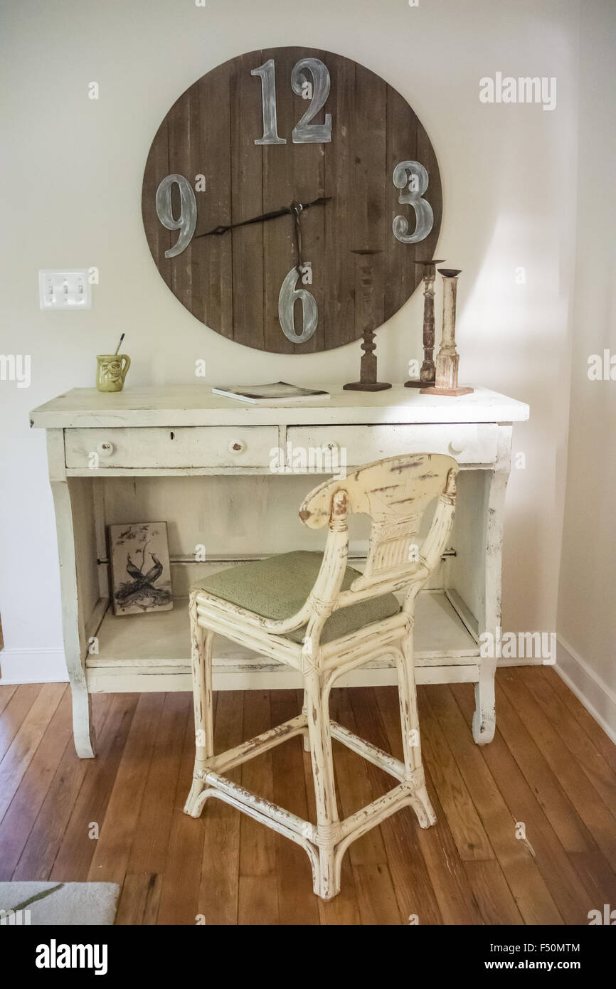 A vintage desk and chair with wooden clock Stock Photo - Alamy